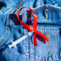 red-ribbon-syringe-needle-denim-jacket-symbol-hiv-aids-cancer-awareness ...